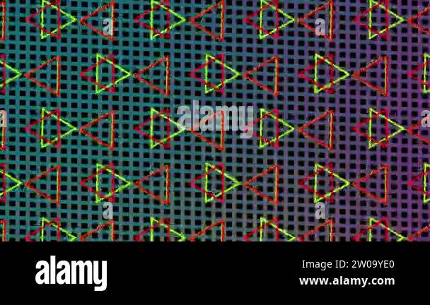 Animation of red and green outline triangles in formation turning in unison on a mesh background ...