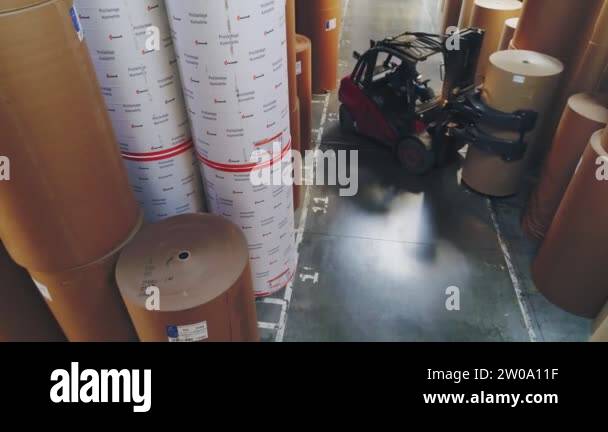 forklift loader transports paper roll in storage upper view Stock Video ...