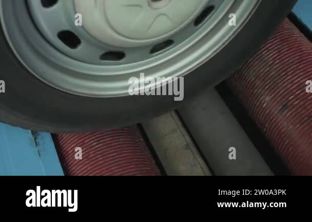 Checking the brake system of the car using the rollers at the service ...