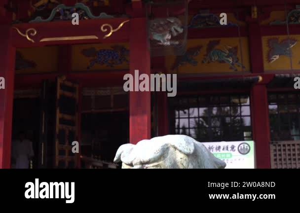 4K Stone statue lion guard in door of Sensoji temple. Ancient buddhist ...