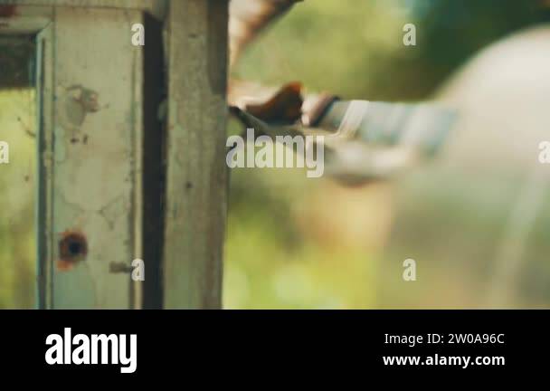 Rainwater flows from the drainage of a dilapidated building. Drops are ...