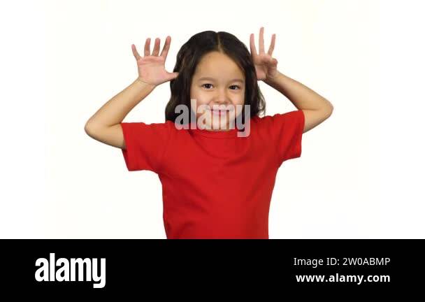 Portrait of happy little girl smile, have fun and act the ape Stock ...