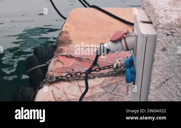 Switch box at pier. Electrical shield at marina. Electric wire held ...