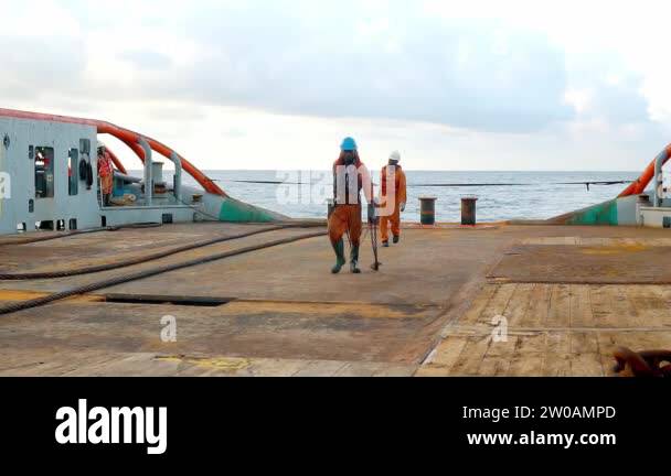 Anchor-handling Tug Supply AHTS vessel crew preparing vessel Stock Video Footage - Alamy