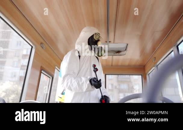 Hero shot of hazmat team worker with antibacterial sanitizer sprayer on ...
