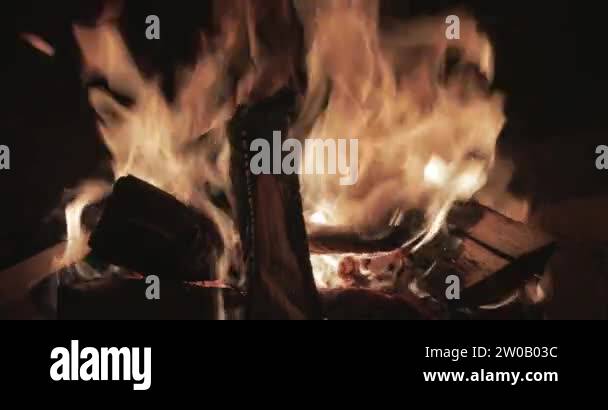 The big fire with firewood in a fireplace, bonfire burning, Brick walls ...