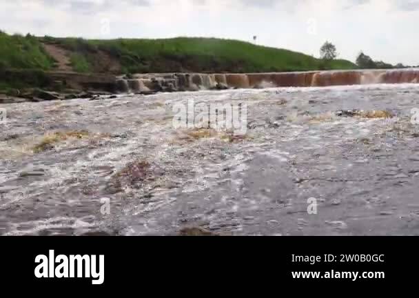 Sablinsky waterfalls. Little waterfall. The brown water of the ...