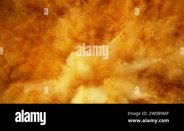 goldwhite powder explosion isolated on black background. Filmed on high ...