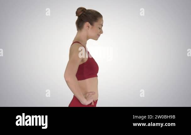 Female walking and doing neck stretching exercise to release build up ...