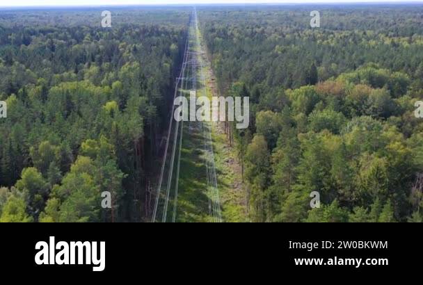Tower of power lines in the forest. Electric tower line in Landscape ...