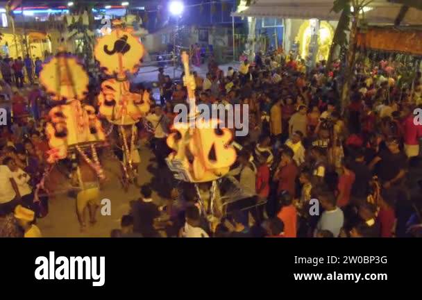 Kavadi is slung across the shoulder. Kavadi devotees arrive and dance ...