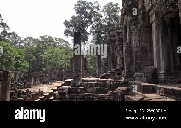4K, View of ancient stone wall at Bayon temple in Angkor Thom. Face ...