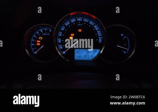 Modern car dashboard with various status symbols in night time Stock ...