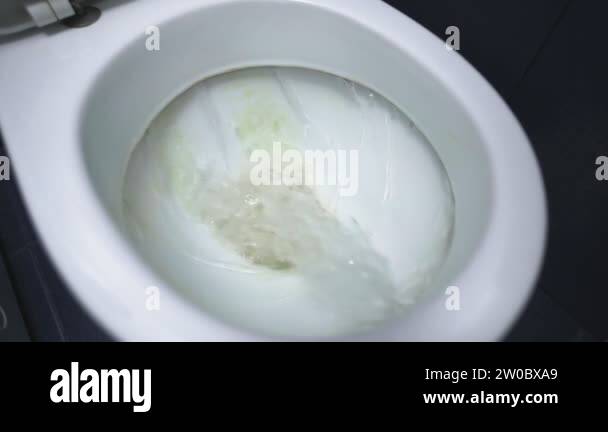 Toilet bowl with running water. Flush clean wc, water splash in toilet ...