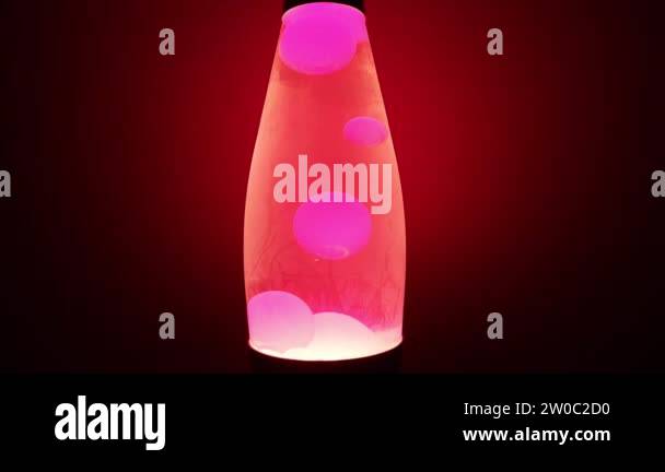 Lava lamp with red lava, 70s design, on clear background. Concept of ...