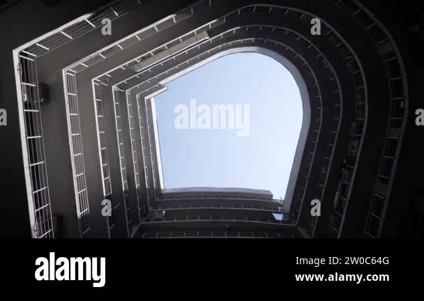 Real estate. A bottom perspective of rounded shaped building. Modern ...