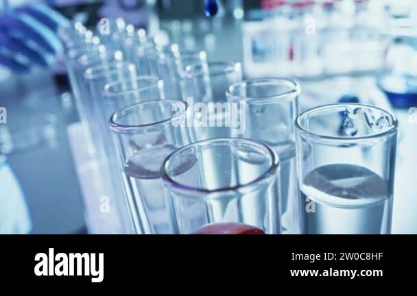 Pharmaceutics Laboratory: Pipette Dropping Blue Liquid into Test Tubes ...