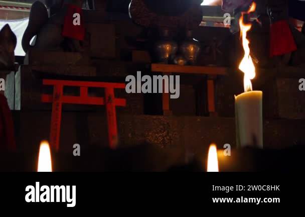 Slow Motion of candles burning in small temple at famous grounds of ...