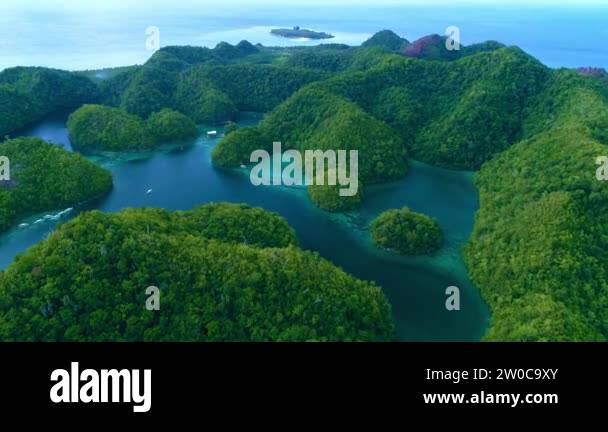 Tropical landscape rainforest hills and azure water in lagoon with ...