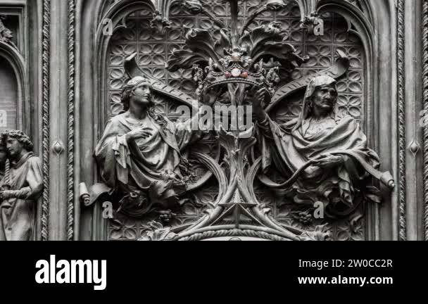Beautiful Duomo di Milano iron gates decor in close up.Jesus Christ ...