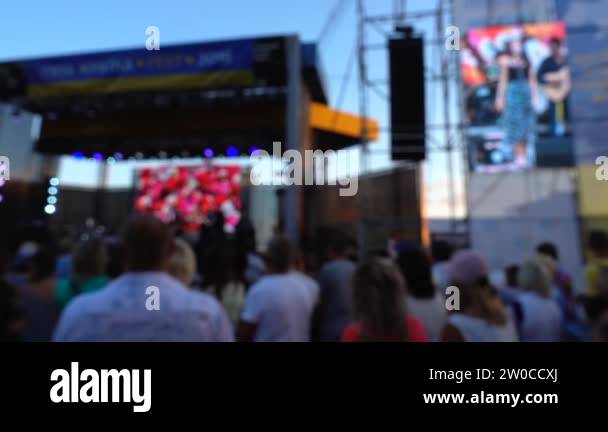 Concert on the stage. Crowd of people and musicians on the scene. Out ...