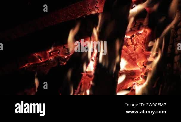 The big fire with firewood in a fireplace, bonfire burning, Brick walls ...