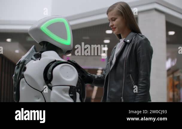 The robot looks at the girl. Artificial intelligence. Modern robotic ...