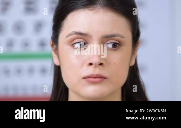 Ophthalmologist putting phoropter on scared female patient eyes, vision ...