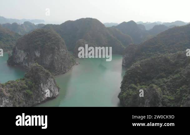 Aerial: unique flying over Ha Long Bay, famous tourism destination in ...
