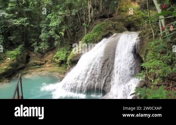 A spectacular view of of the popular sloped waterfall from behind some ...