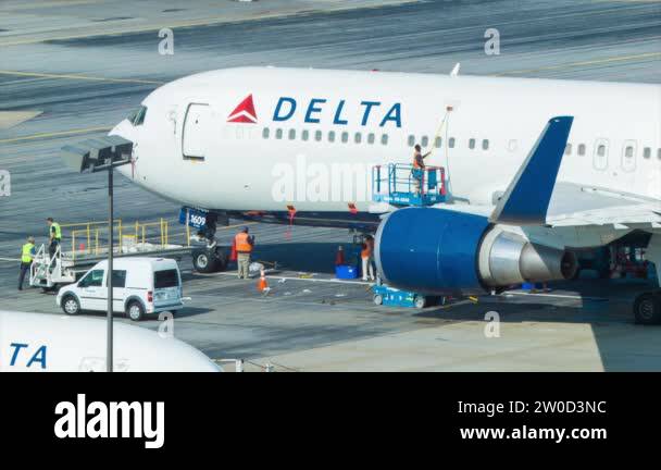 Delta Airlines Boeing Commercial Airplane Being Cleaned by Ground Staff ...