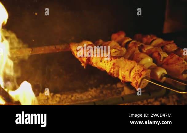 Traditional kebab on the grill with skewers in the turkish restaurant ...