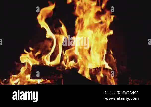 Close-up photo of bright burning fire at the bottom of shot. Flame ...