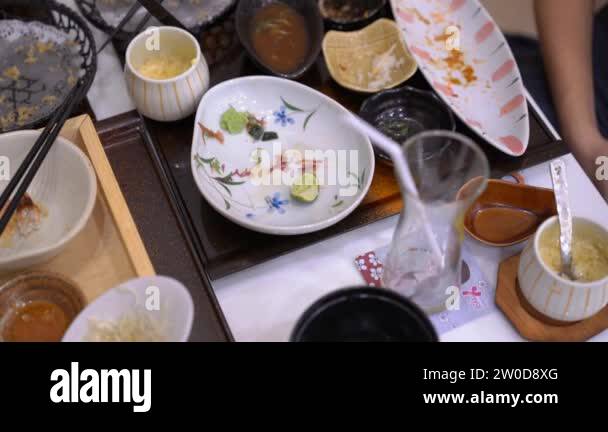 Empty plates and cups after meal in a japanese restaurant. concept of a ...