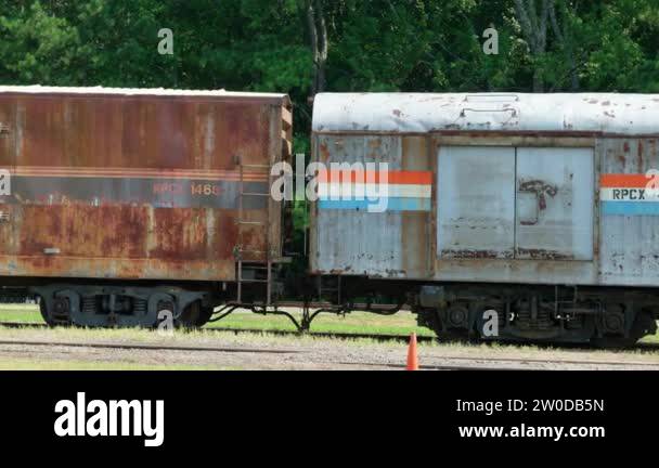 Abandoned train boxcars no longer in service left to rust and decay on ...