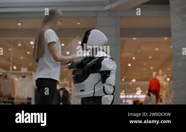 The robot looks at the girl. Artificial intelligence. Modern robotic ...