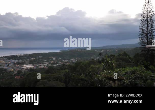 Slow motion panning view of Ocho Rios from high on the hill with the ...