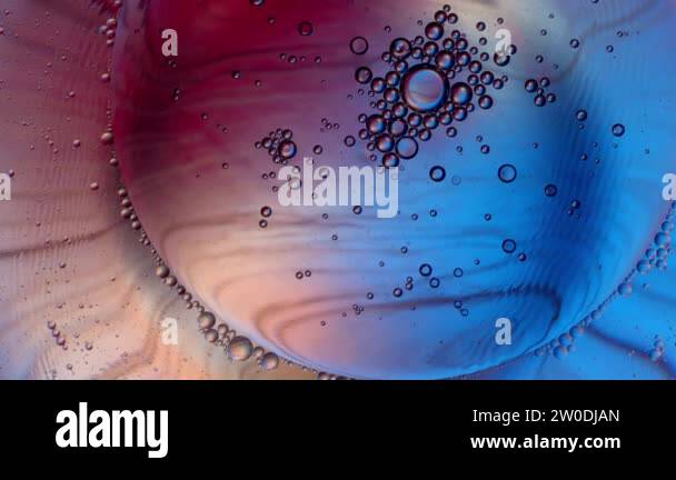 research concept under a microscope, a large cell, small cells in it ...