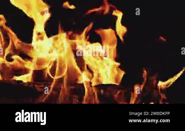 Close-up photo of bright burning fire at the bottom of shot. Flame ...