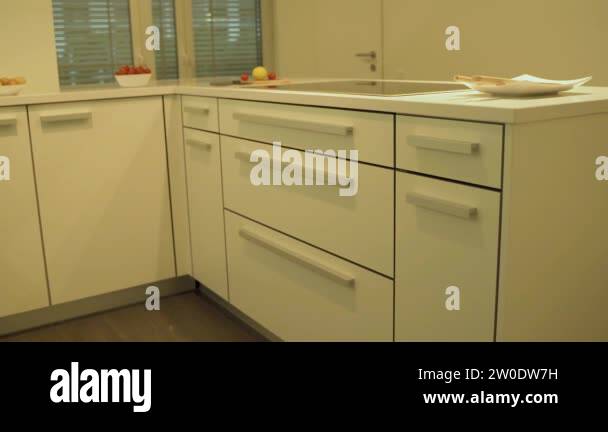 Side view of the modern white kitchen design and modern kitchen quartz ...