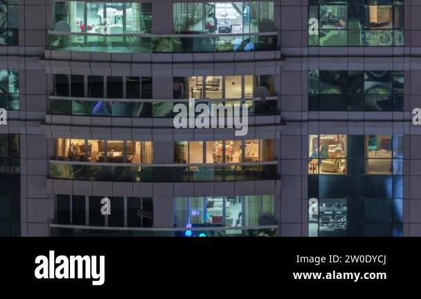 Night view of exterior apartment building timelapse. High rise ...