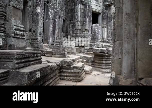 4K, View of ancient stone wall at Bayon temple in Angkor Thom. Face ...
