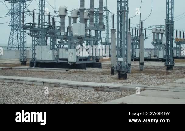 High voltage substation 110 kV with tall pylons and hog voltage ...