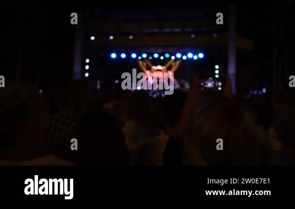 Concert on the stage. Crowd of people and musicians on the scene. Out ...