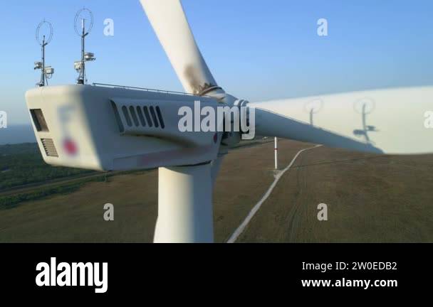 Close up of a wind turbine. Aerial top view wind turbine, moving above ...