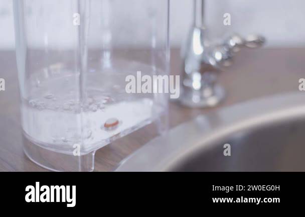 Process of rectangular plastic water tank being filled with tap water ...