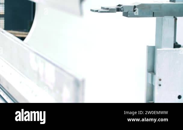 Mechanism for holding metal plates on automated line. Robotic unit ...