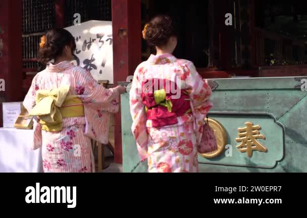 Tokyo, Japan-01 October, 2017: 4K Young Japanese Geisha pray and throw ...