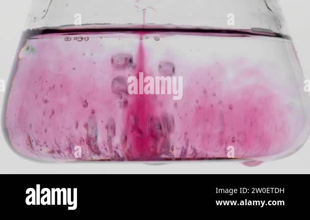 Close-up shooting. Adding a pink element to a transparent one and their ...