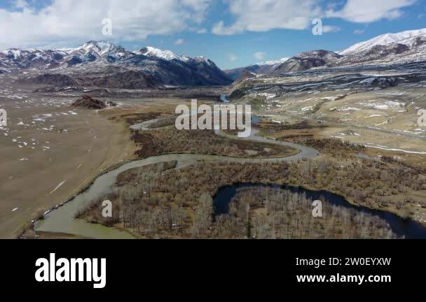 Video from a drone flying along valley of the Chuya river in Spring ...